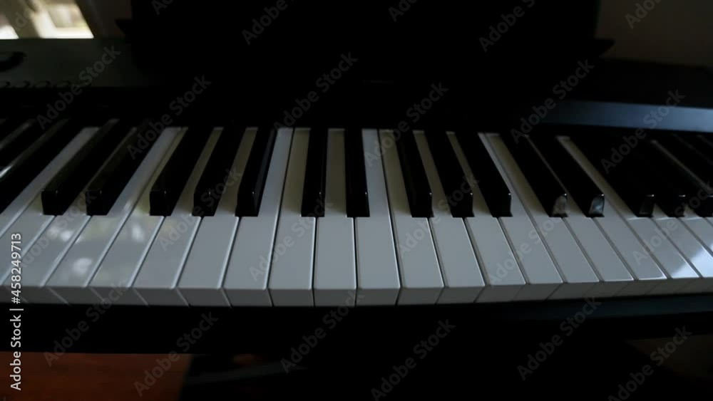 acoustic or digital piano keyboard, black and white piano keys, music ...