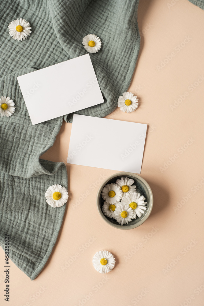 Blank paper sheet card with mockup copy space, chamomile flower buds ...