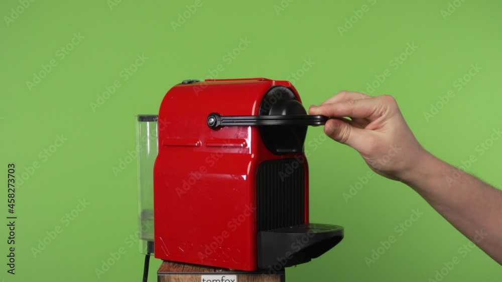 Nespresso Machine making coffee in front of chroma green screen Stock ...