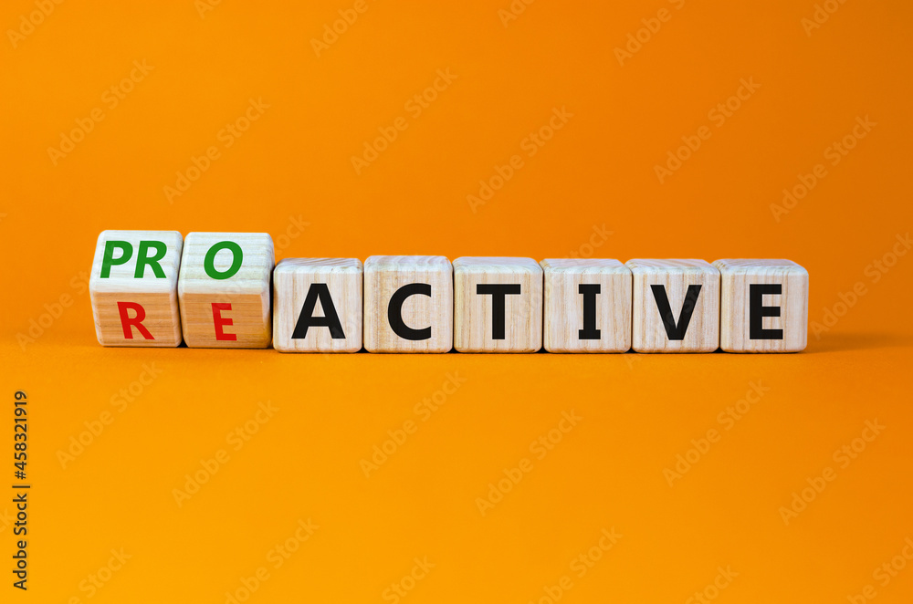 Reactive or proactive symbol. Turned wooden cubes and changed the word ... Reactive or proactive symbol. Turned wooden cubes and changed the word ...
