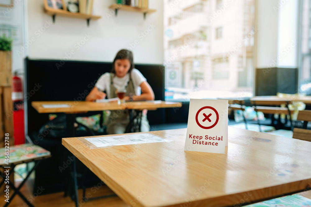 Coffee shop table with do not use sign to keep social distance with ...