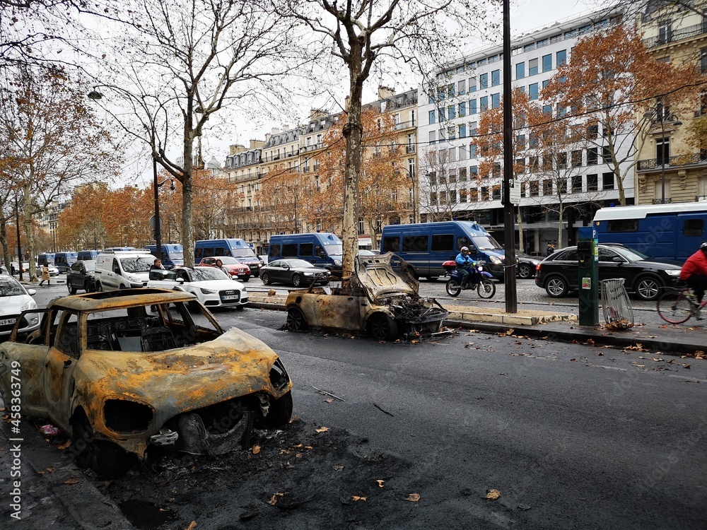 Burned and destroyed car in the city centre of Paris due to riots and ...