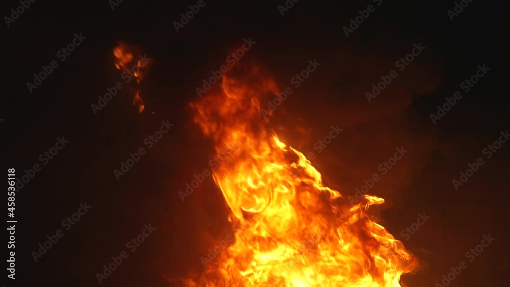 Fire and flames from burning rubber on dark background. Heat footage ...