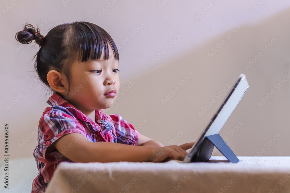 Portrait image of 3-4 years old preschool kid. Bored Asian child girl ...