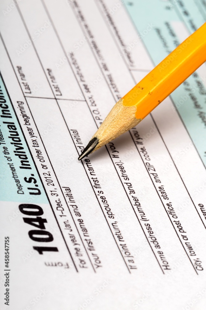Tax Form 1040 with a pencil, Filing Documents Stock Photo | Adobe Stock