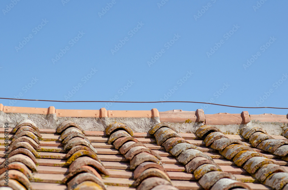 House: pitched roofs with brick tiles, exposed upper ridge and ridge ...