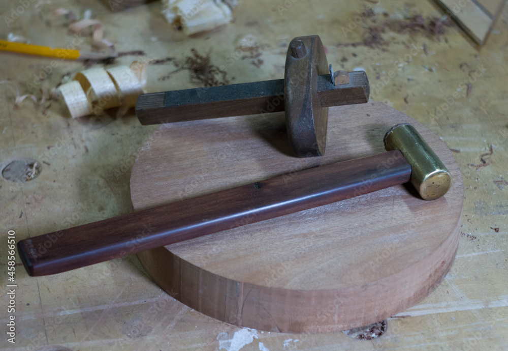 Joiner's hammer made of brass and a marker thickness gauge. Hand tool ...