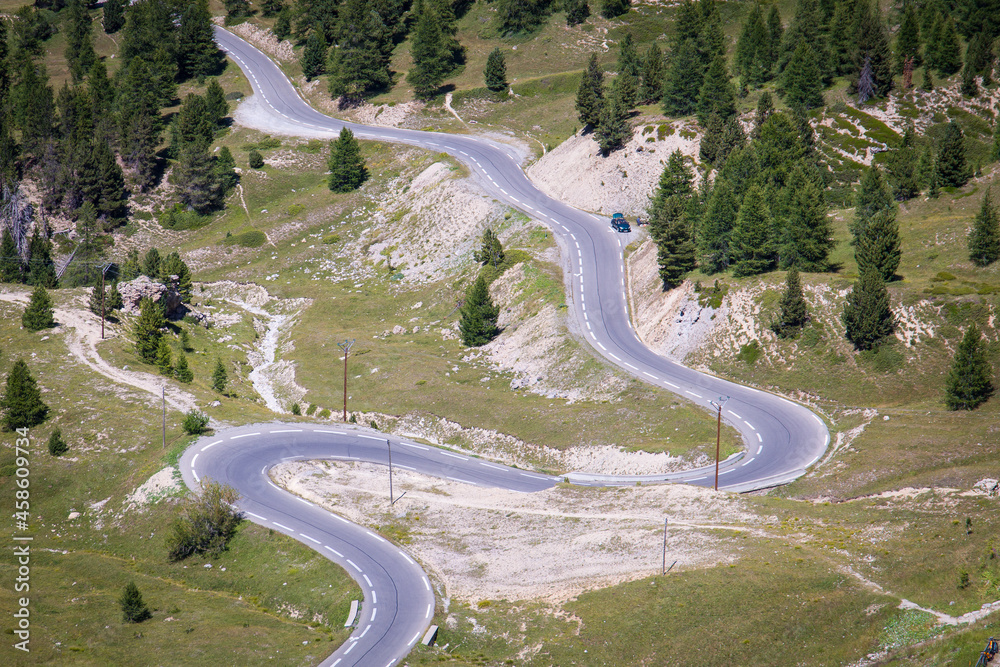 Curvy and beautiful mountain pass road Col D'Izoard in the french alps ...