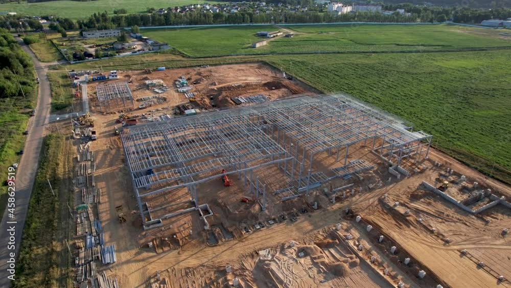 Construction of warehouse from metal structures. Industrial building on ...