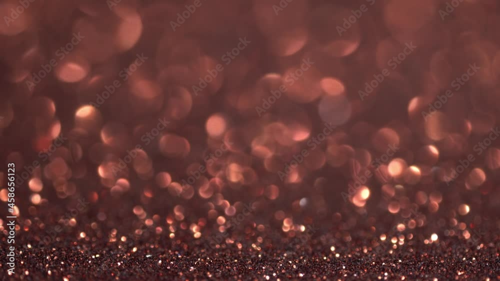 Abstract copper glitter background with moving and flicker particles ...