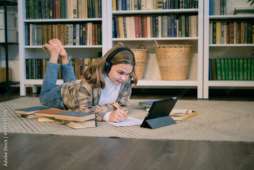 Teenage girl doing homework at a desk in her bedroom. teen girl school ...