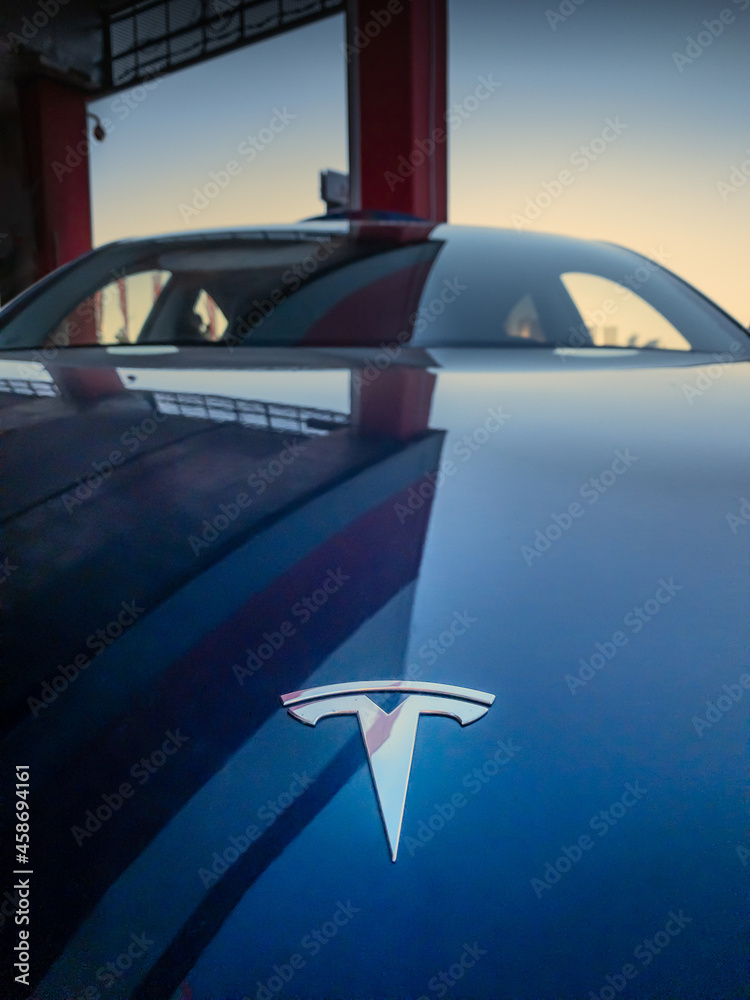 Tesla logo on Tesla Model 3 car hood Stock Photo | Adobe Stock
