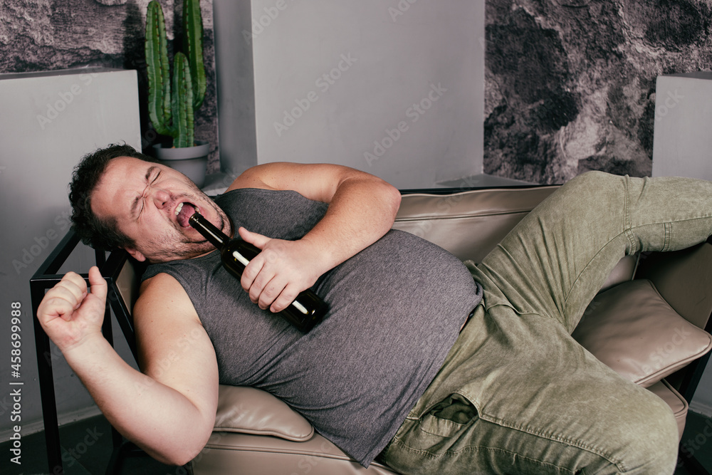 Drunk funny fat man. Alcohol problems. Stock Photo | Adobe Stock