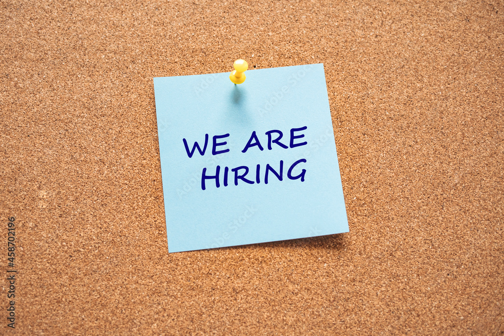 We are hiring written white note paper. Paper note on cork board ...