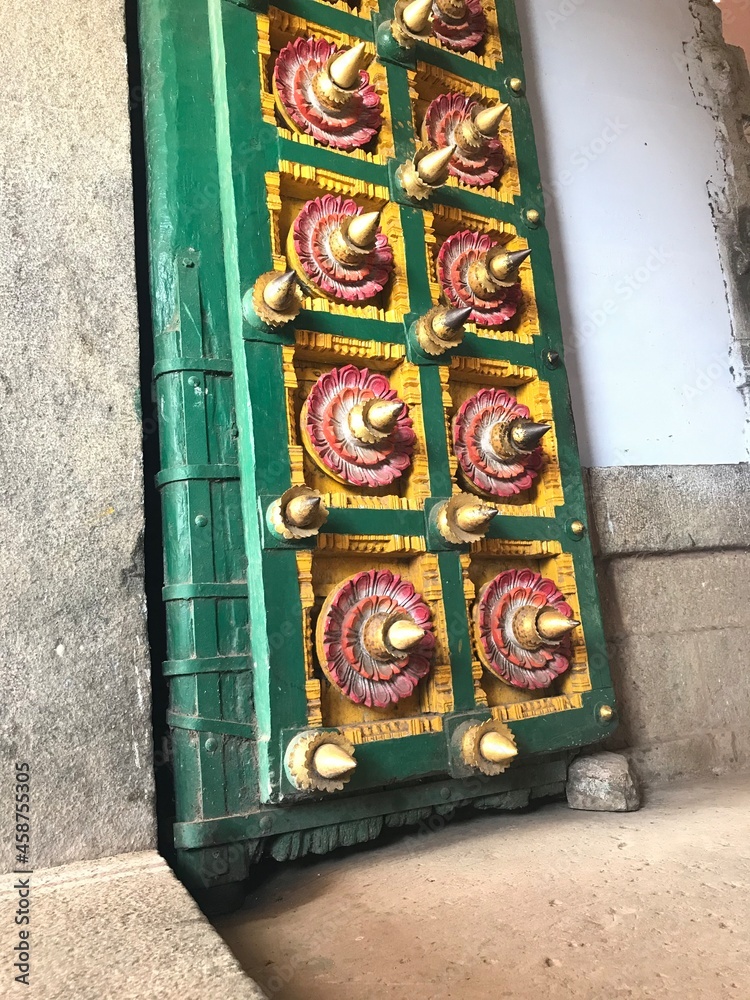 Temple Door with sharp steel nodes and wooden make with colorful ...