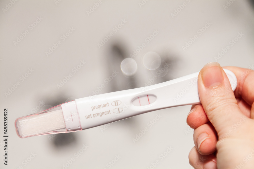 Positive pregnancy test showing two lines Stock Photo | Adobe Stock