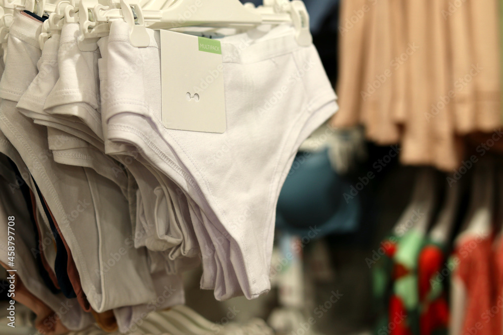 Women's white panties in the store with a white empty label for the ...