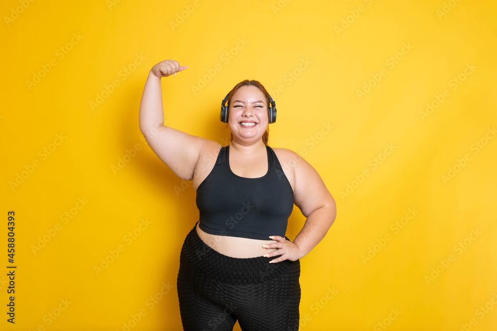 Hispanic overweight fitness model wearing sportswear in strong and ...