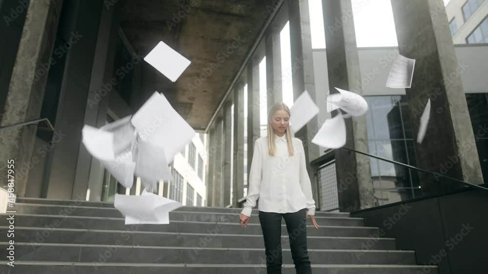 Angry furious female office worker throwing away stack of documents and ...