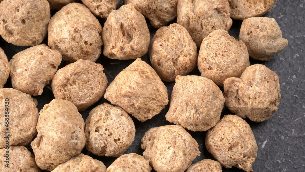 Raw soya chunks on dark background. Healthy, nutritious soybean meat ...