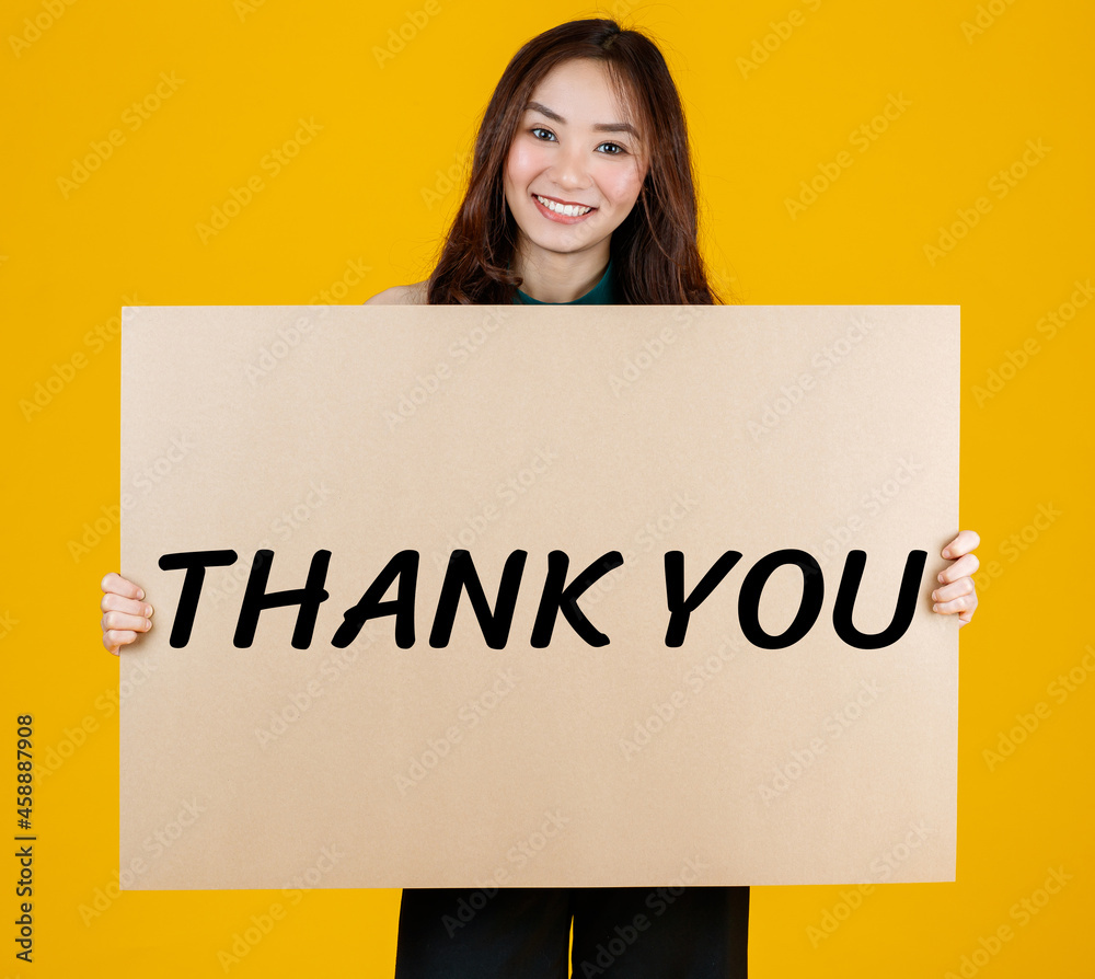 Young happy Asian women smiling and holding huge cardboard sign with ...