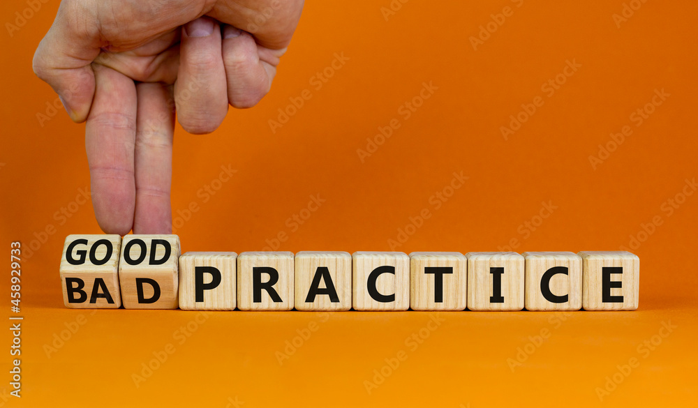 Good or bad practice symbol. Businessman turns wooden cubes and changes words 'bad practice' to ...