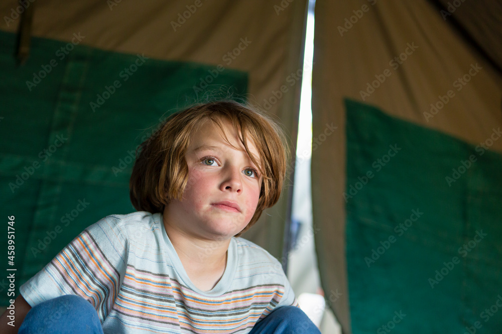 Portrait of young boy in tent, Okavango Delta, Botswana. Stock Photo ...