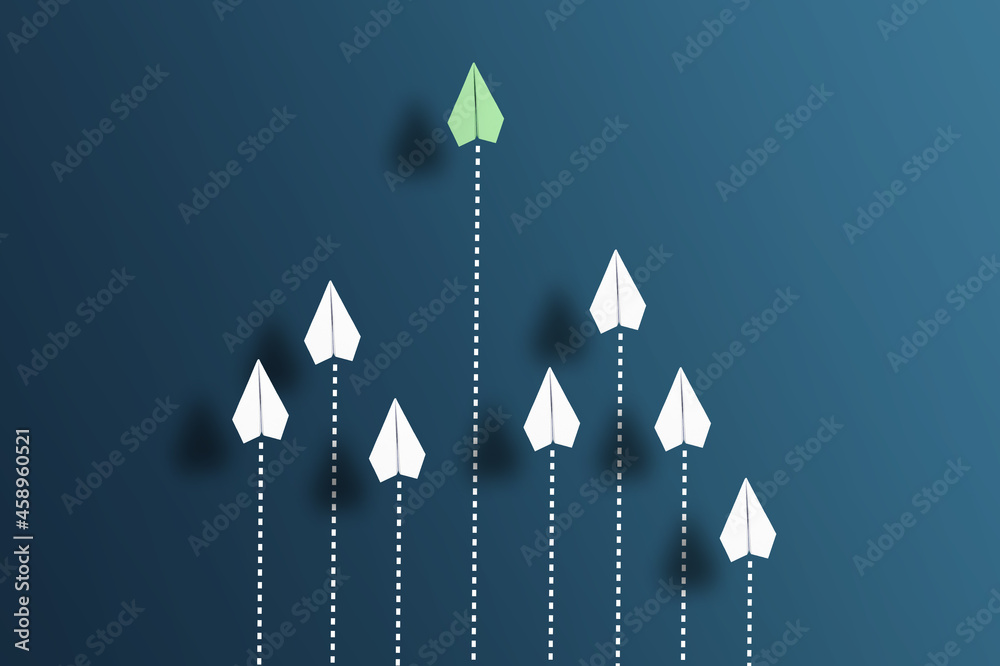 paper planes flying in formation in one direction on blue background ...