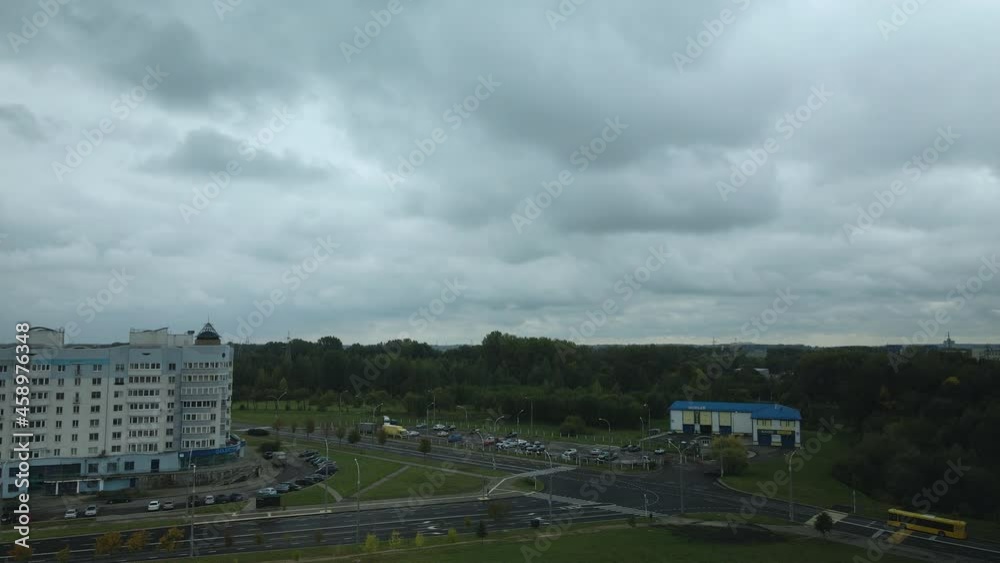 Flight over the city block in cloudy weather. Multi-storey buildings ...