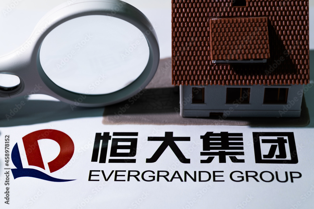 China Evergrande Group logo with small house model and magnifier Stock ...