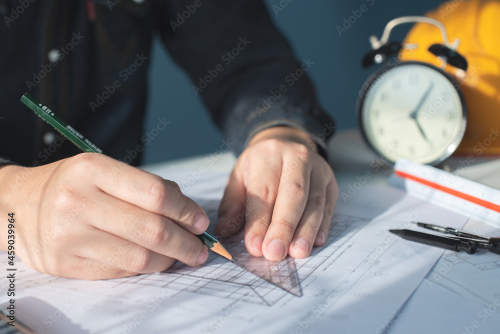 Architect working on blueprint. Architects workplace - architectural ...