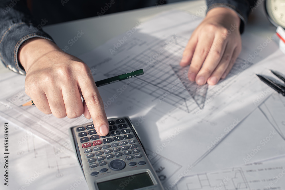 Architect working on blueprint. Architects workplace - architectural ...