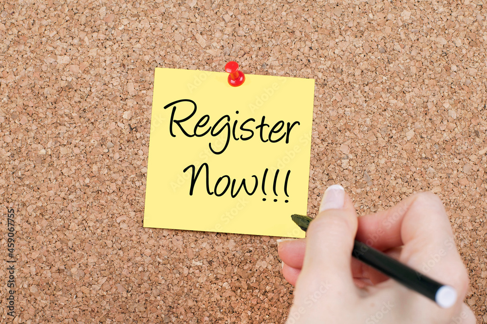 Hand writing register now on paper Stock Photo | Adobe Stock