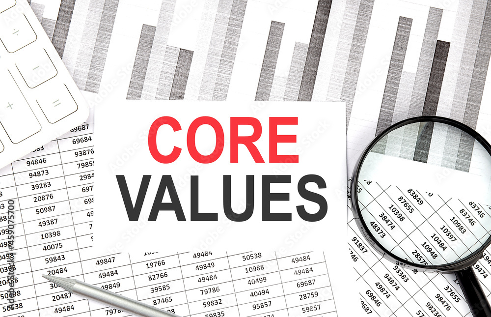 CORE VALUES text on the paper with calculator,magnifier ,pen on the ...