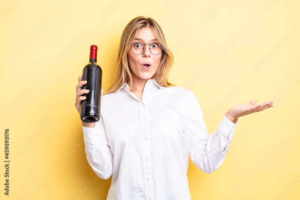 pretty blonde girl looking surprised and shocked, with jaw dropped ...