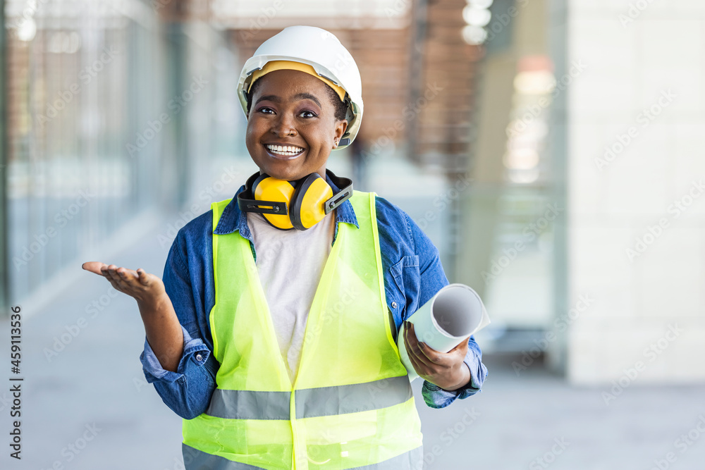 Female construction engineer. Architect with a blueprints at a ...