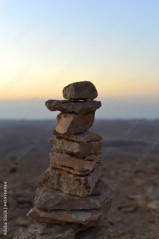 Cairn at sunrise, stones balances, pyramid of stones at sunset, concept ...