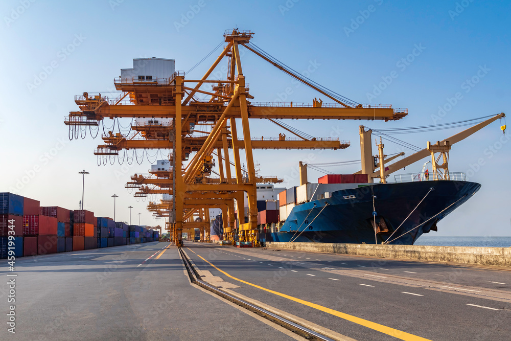 Container loading in a cargo freight ship with crane to shore lift up ...