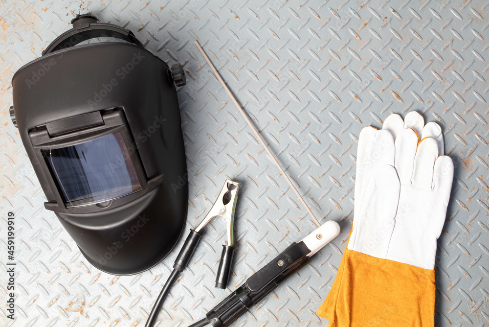 Welding equipment on a metal desk with workshop welding mask,Leather ...