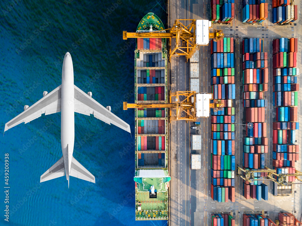 Above view of passenger commercial airplane flying over ship cargo ...