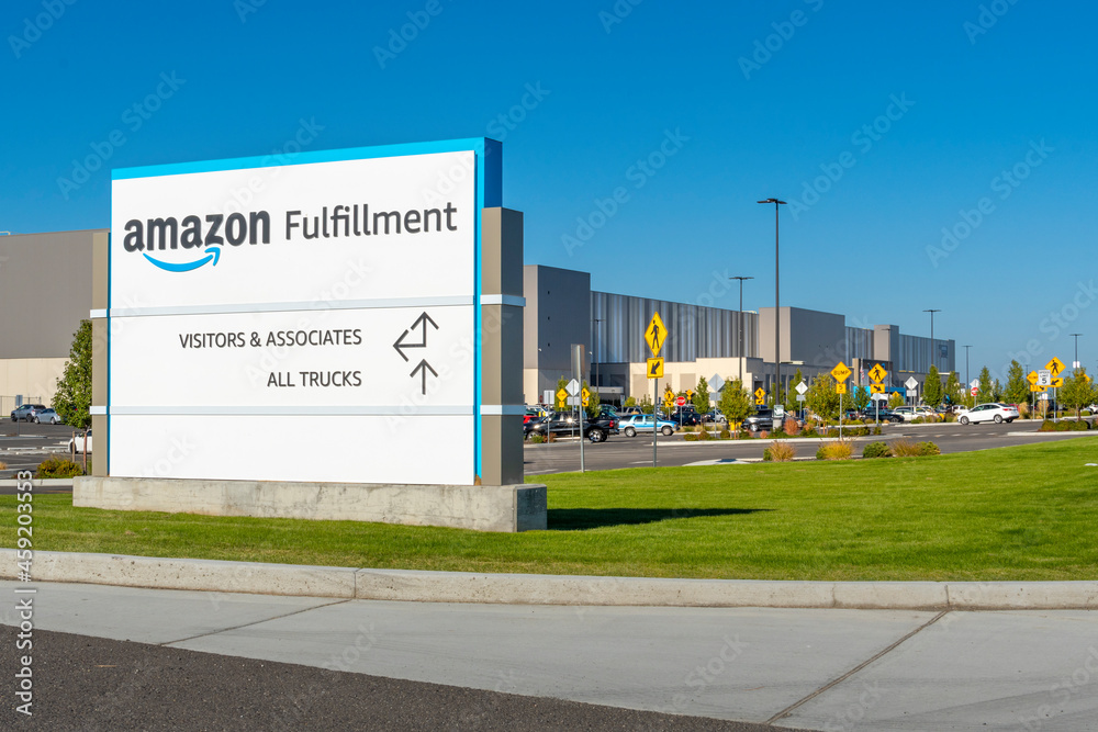 General view of the welcome sign and building of the Amazon Fulfillment ...