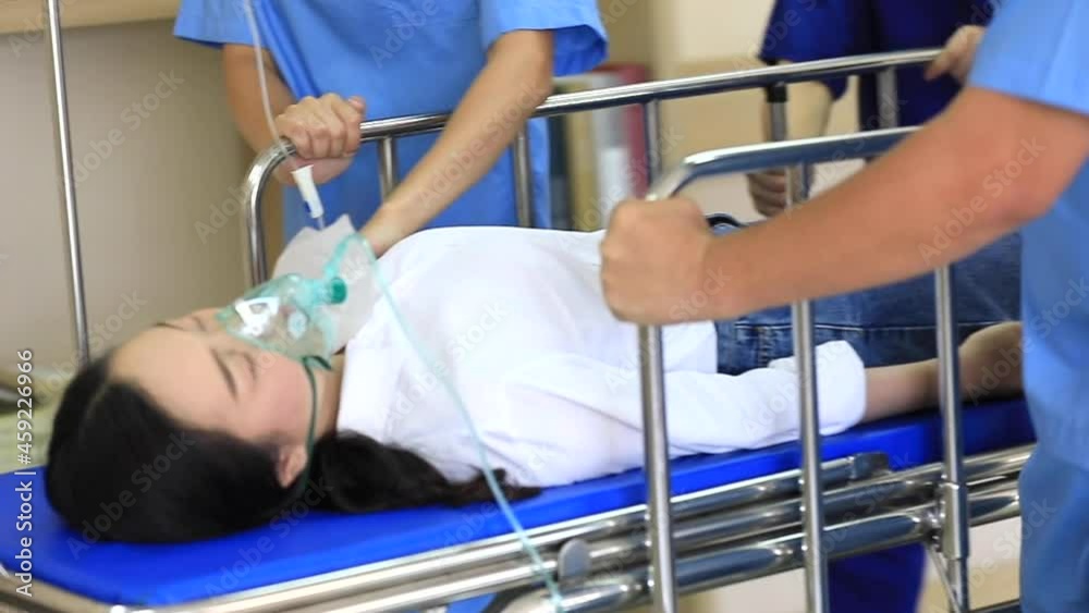 Group of Asian doctors and nurses team wearing face mask, push ...