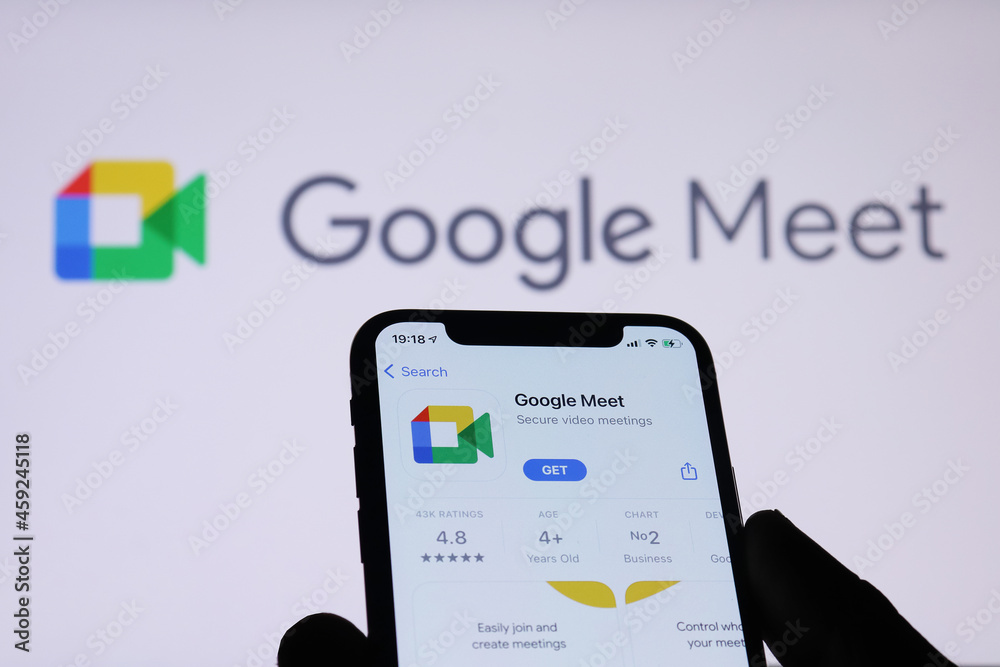 Google Meet application on phone screen and Google Meet logo background ...