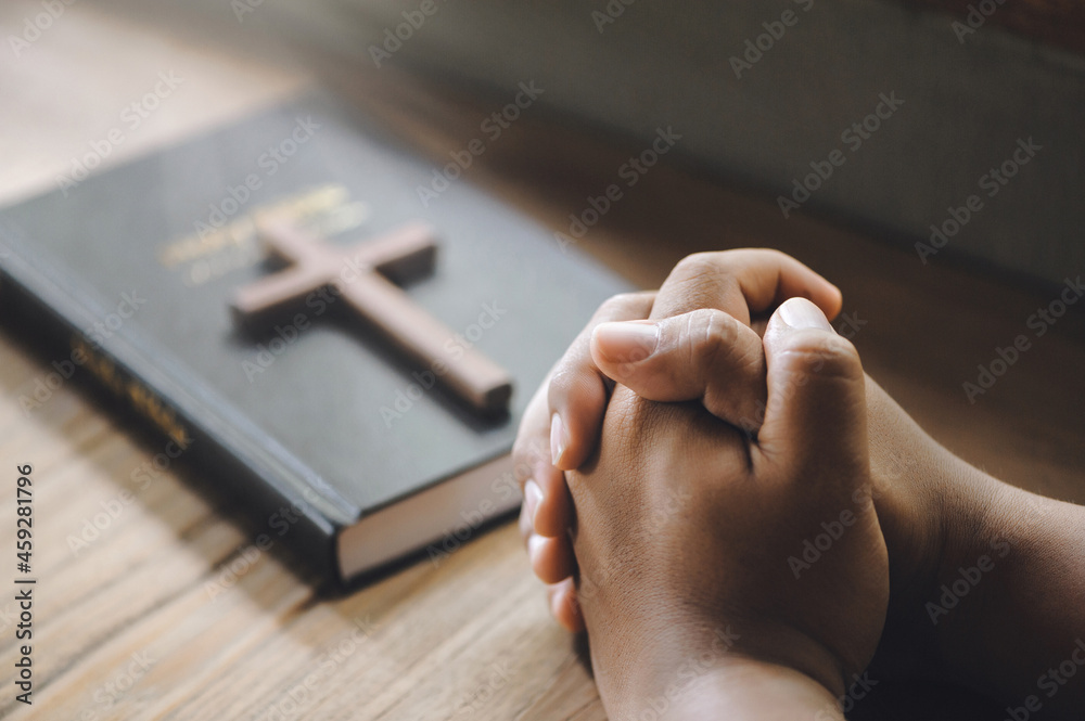 Christian man hand praying to god with the bible. believe in goodness ...