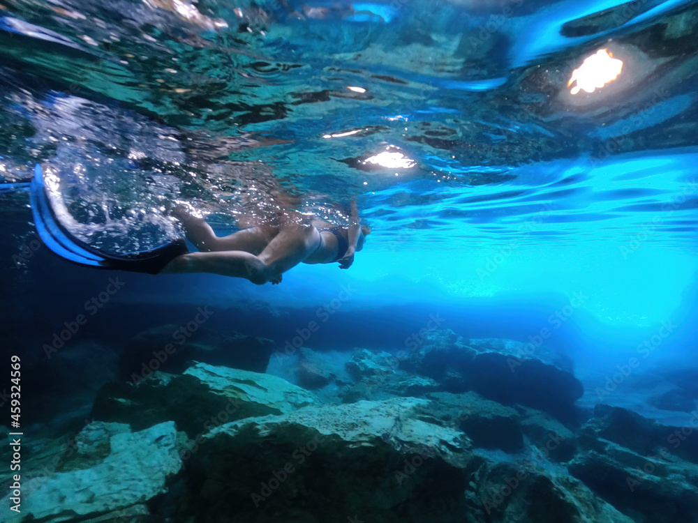 Underwater split photo of beautiful paradise volcanic white rock famous ...