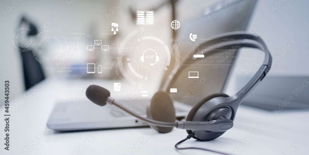 close up soft focus on headset with telephone devices at office desk ...