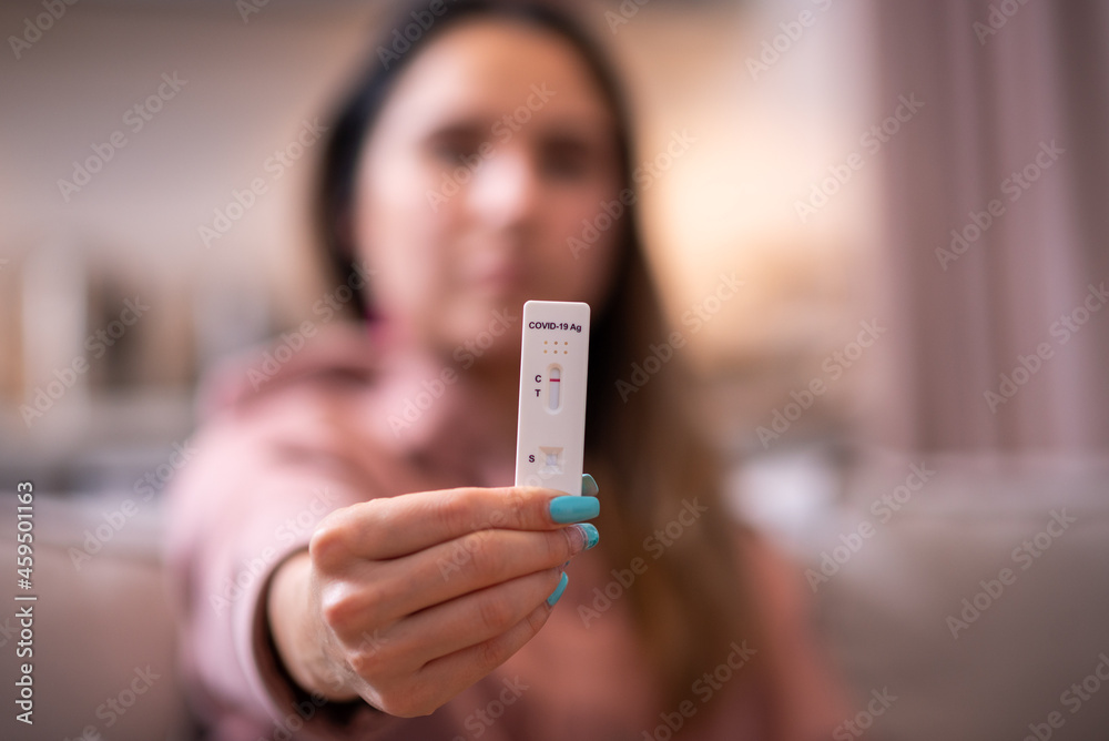 Girl holding a corona virus SARS-Cov-2 rapid antigen test Stock Photo ...