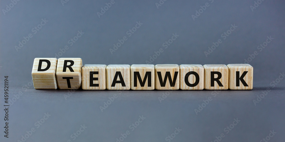 Teamwork and dream work symbol. Turned wooden cubes and changed the ...
