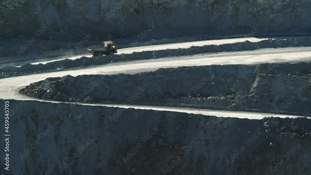 Open pit, large coal mine quarry. Mining dump trucks in the open pit ...