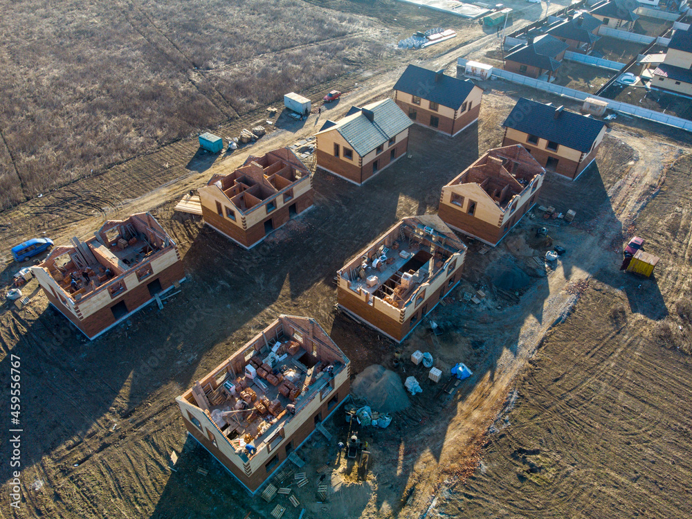 Newly built homes in a residential estate. Construction of the building ...